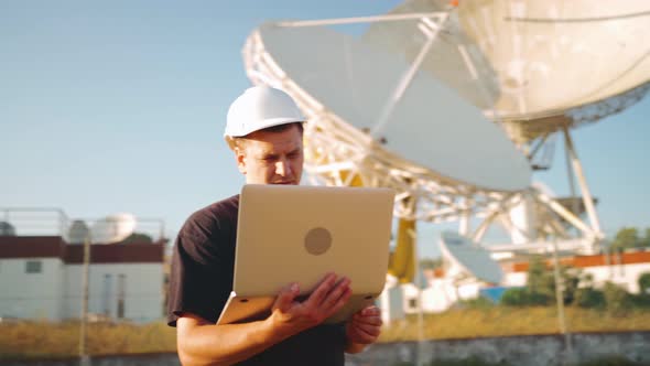 Engineer Looking Earth Based Astronomical Radio Telescope, Stock Footage