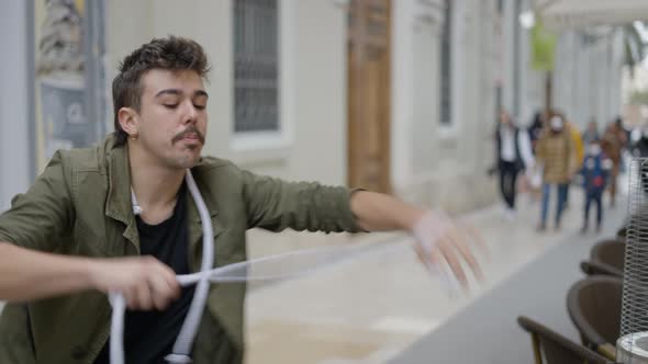Close Up View of a Magician Man Doing Magic Tricks with White Ropes to ...