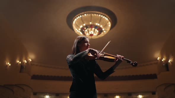Professional Female Violinist is Playing Violin on Scene of Opera House ...