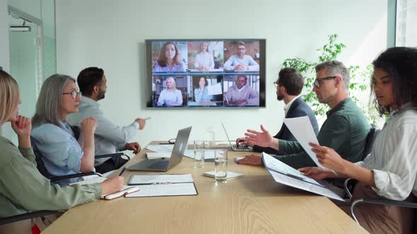 Diverse Employees on Online Conference Video Call on Tv Screen in ...