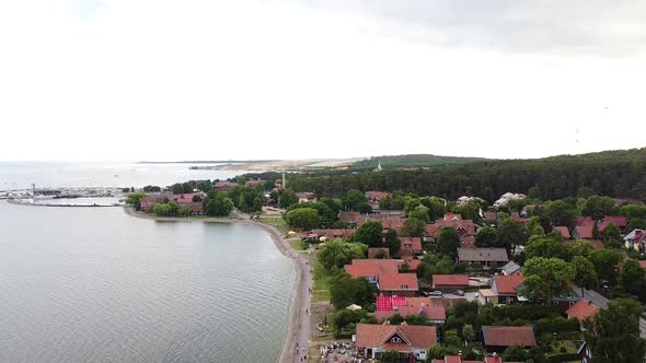 Coastal walkway in Nida town, aerial descending view, Stock Footage