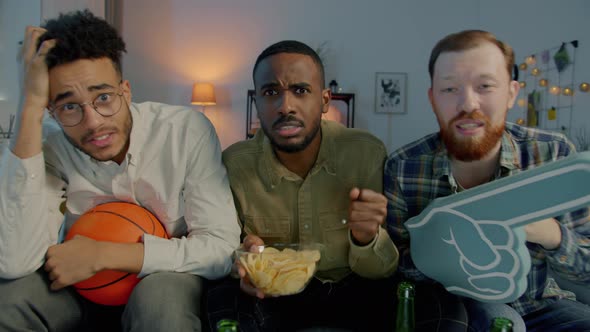 Portrait of Emotional Sports Fans Watching Basketball Game on TV at ...