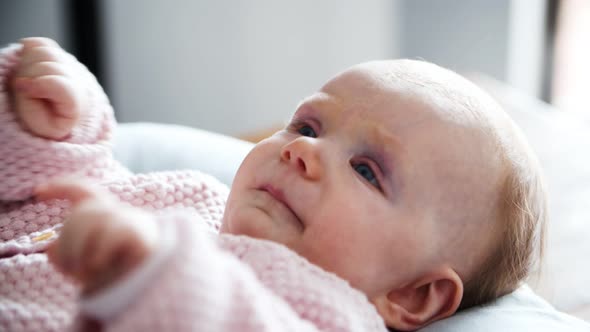 Annoyed Baby Lying in Bedding, Stock Footage | VideoHive