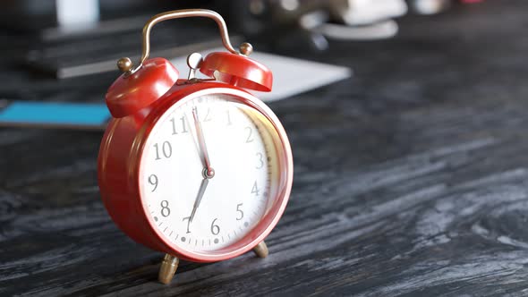 Old vintage red alarm clock shaking and ringing on an office desk. 4KHD ...