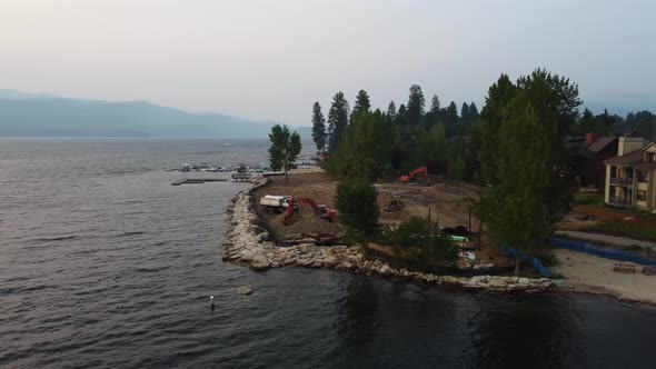 Clockwise drone shot of construction on the shore of Payette Lake ...
