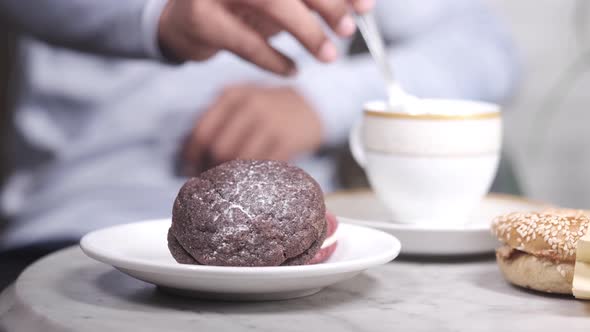 Young Man Hand Pick Cookies and Drinking Tea, Stock Footage | VideoHive