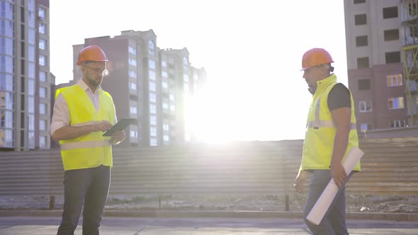 Builders Meet in the Early Morning Sunrise, Stock Footage | VideoHive