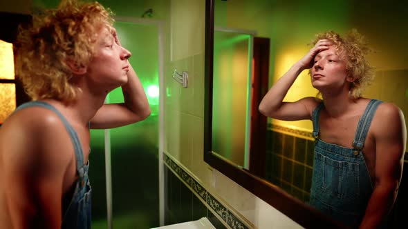 Reflection in Mirror of Confident Caucasian Concentrated LGBT Man ...