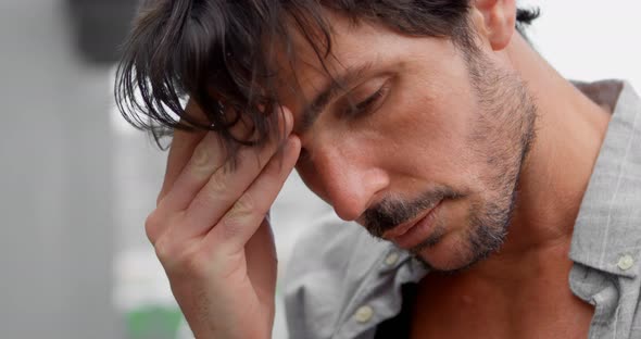 Tense man touching his forehead 4k, Stock Footage | VideoHive