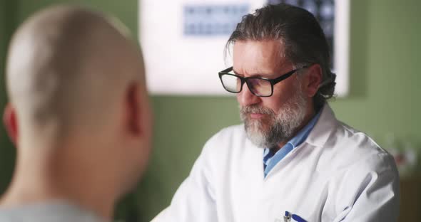 Man with Cancer Crying and Speaking with Doctor, Stock Footage | VideoHive
