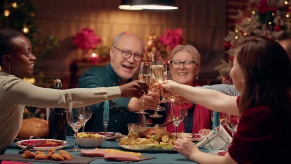 Positive Festive People Celebrating Christmas at Evening Dinner While ...