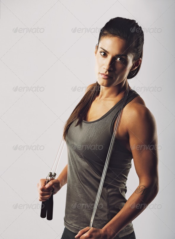 Female athlete posing with jumping rope Stock Photo by jacoblund ...