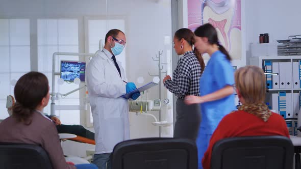Doctor Taking Notes on Clipboard About Patient, Stock Footage | VideoHive