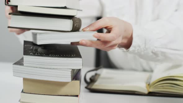 Picking up a book, Stock Footage | VideoHive