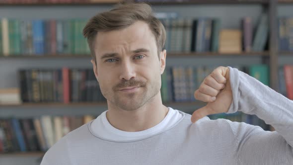 Sad Adult Man Gesturing Thumbs Down at Work, Stock Footage | VideoHive