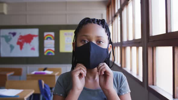 Girl wearing face mask in the class at school, Stock Footage | VideoHive