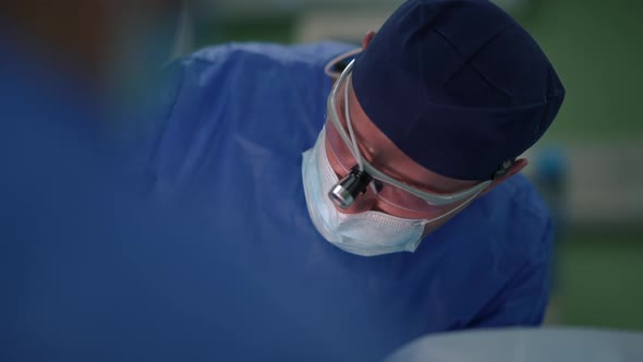 Closeup Front View Concentrated Surgeon Making Dissection on Face of ...