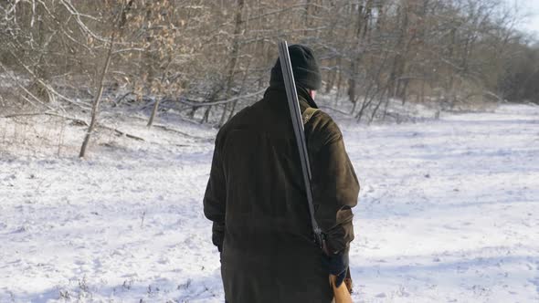 Hunter Walking in the Snowy Winter Forest. Winter Hobby, Sun, Hunting ...