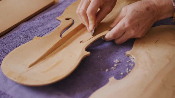 Female luthier at work in her workshop, Stock Footage | VideoHive