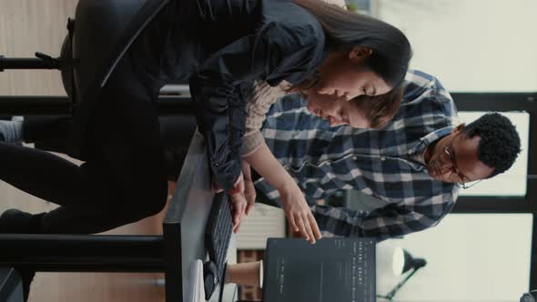 Vertical Video Programmers Collaborating On Group Project Compiling Algorithm For New Cloud