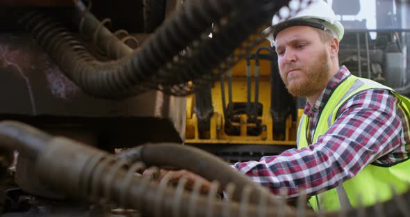 Male worker looking at machine , Stock Footage | VideoHive