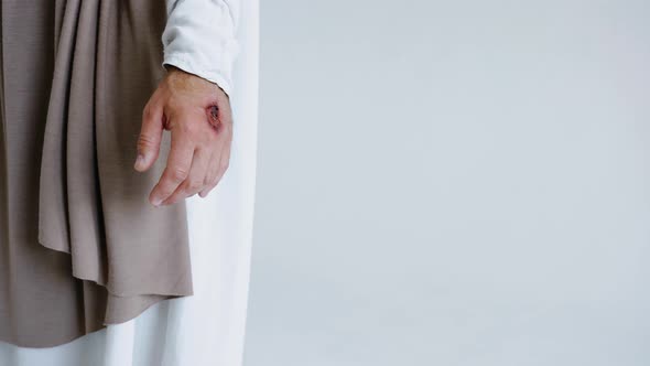 Jesus' Hands with Stigmata on a White Background, Stock Footage | VideoHive