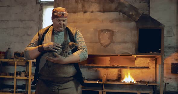 Blacksmith Holding a Cat, Stock Footage | VideoHive