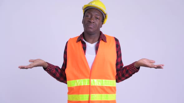 Young Confused African Man Construction Worker Shrugging Shoulders ...