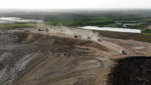 Tipper Lorries Throw Rubbish on Garbage Dump Causing Dust, Stock Footage
