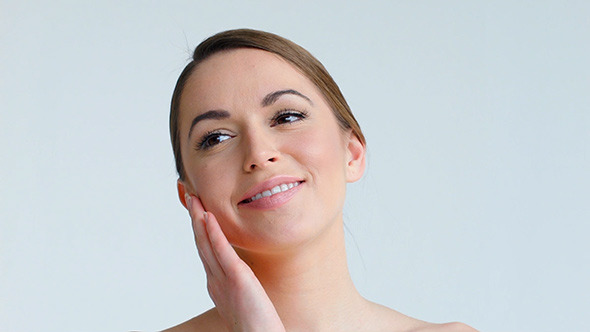 Pretty Natural Young Woman Touching Her Cheek, Stock Footage | VideoHive