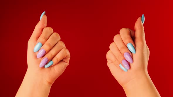 Woman's Hands with Beautiful Nails on Red Background, Stock Footage