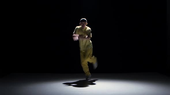 Breakdance Dancer in Yellow Suit Dance on Black, Shadow, Stock Footage