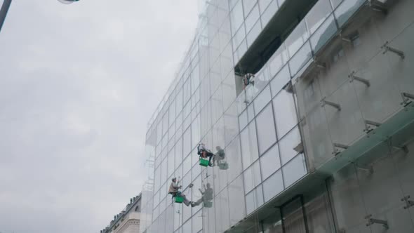 Industrial Window Cleaners at a High Height of the Glass Facade, Stock ...