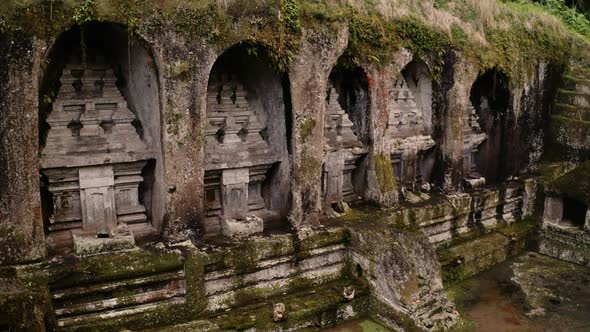 Shrines cut into cliff niches at historic Kawi Sebatu temple in Ubud ...
