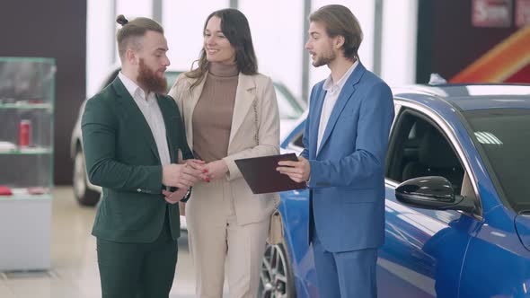 Positive Dealer and Buyer Shaking Hands As Cheerful Beautiful Woman ...