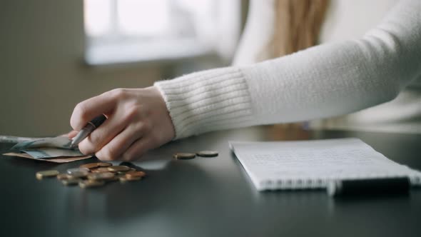 A Woman Is Counting a Remaining Money Distributing the Spending and ...