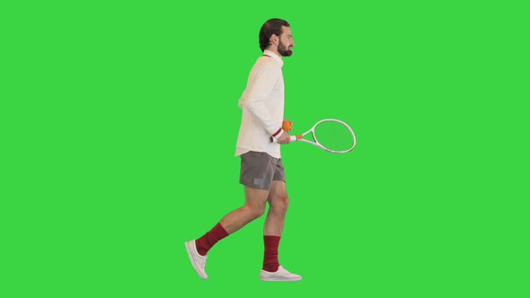 Handsome Tennis Player Running with Tennis Racket on a Green Screen ...