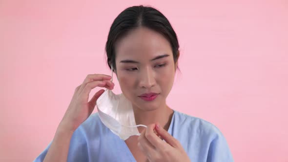 Young Asian Woman Take Off Face Mask Removing From Face, Stock Footage