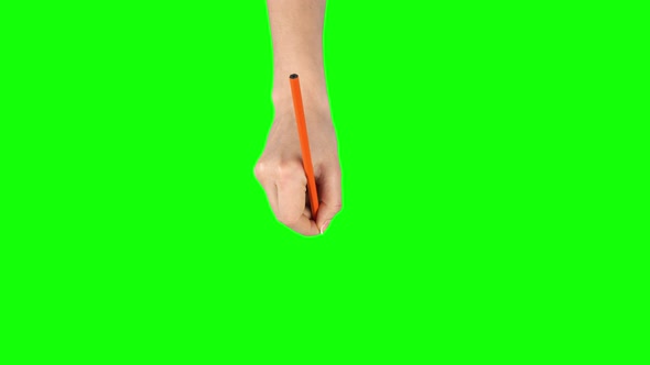 Female Hand with Orange Pencil Is Writing on Green Screen Background ...