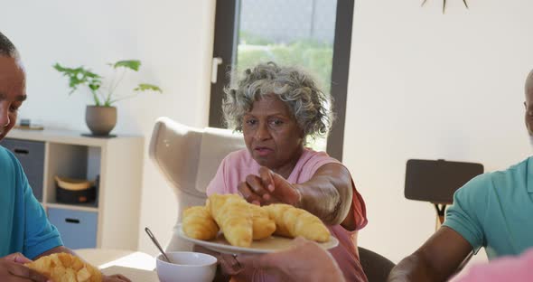 Happy senior diverse people having breakfast at retirement home, Stock ...