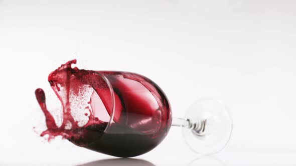 Glass of red wine falling and wine spilling over, Slow Motion, Stock ...