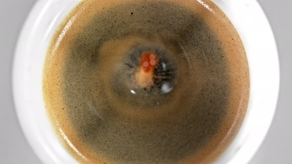 Super Slow Motion Detail Shot of Coffe Drop Falling Into Fresh Espresso ...