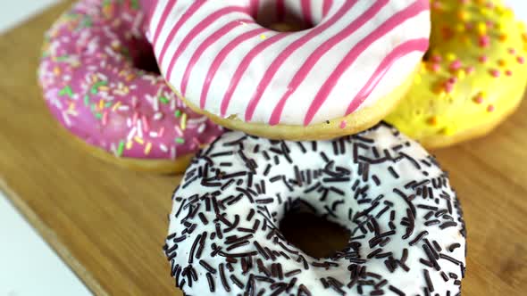 Rotating Donuts with Different Fillings on the Table by Merlinus74