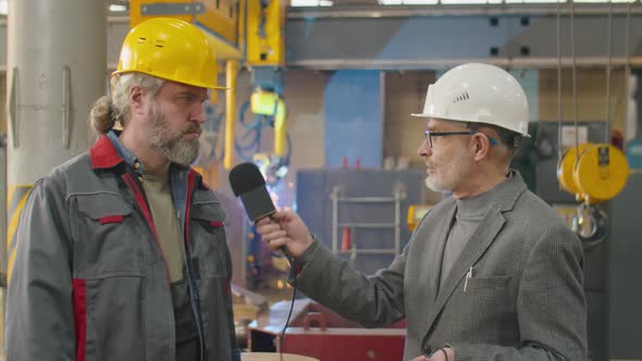 TV Journalist Interviewing Factory Worker, Stock Footage | VideoHive