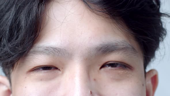 Close up of Asian Man's face. Attractive boy with beautiful eyes ...