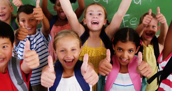 School kids showing thumbs up in classroom, Stock Footage | VideoHive