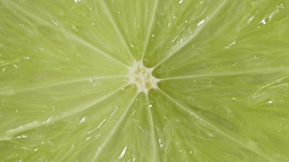 Macro View of Lime Slice Rotation. Extreme Closeup of Green Juicy ...