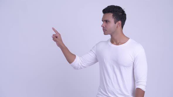 Happy Young Indian Man Touching Something, Stock Footage | VideoHive