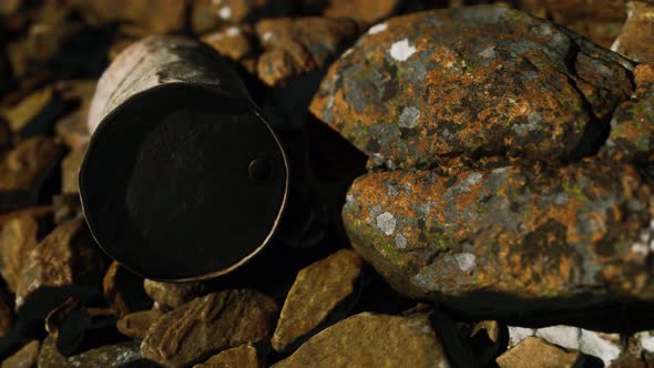 Rusty Destroyed Metal Barrel on Beach Rocks, Motion Graphics | VideoHive