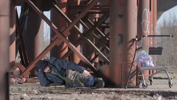 Homeless Man Sleeping Under the Bridge, Stock Footage | VideoHive
